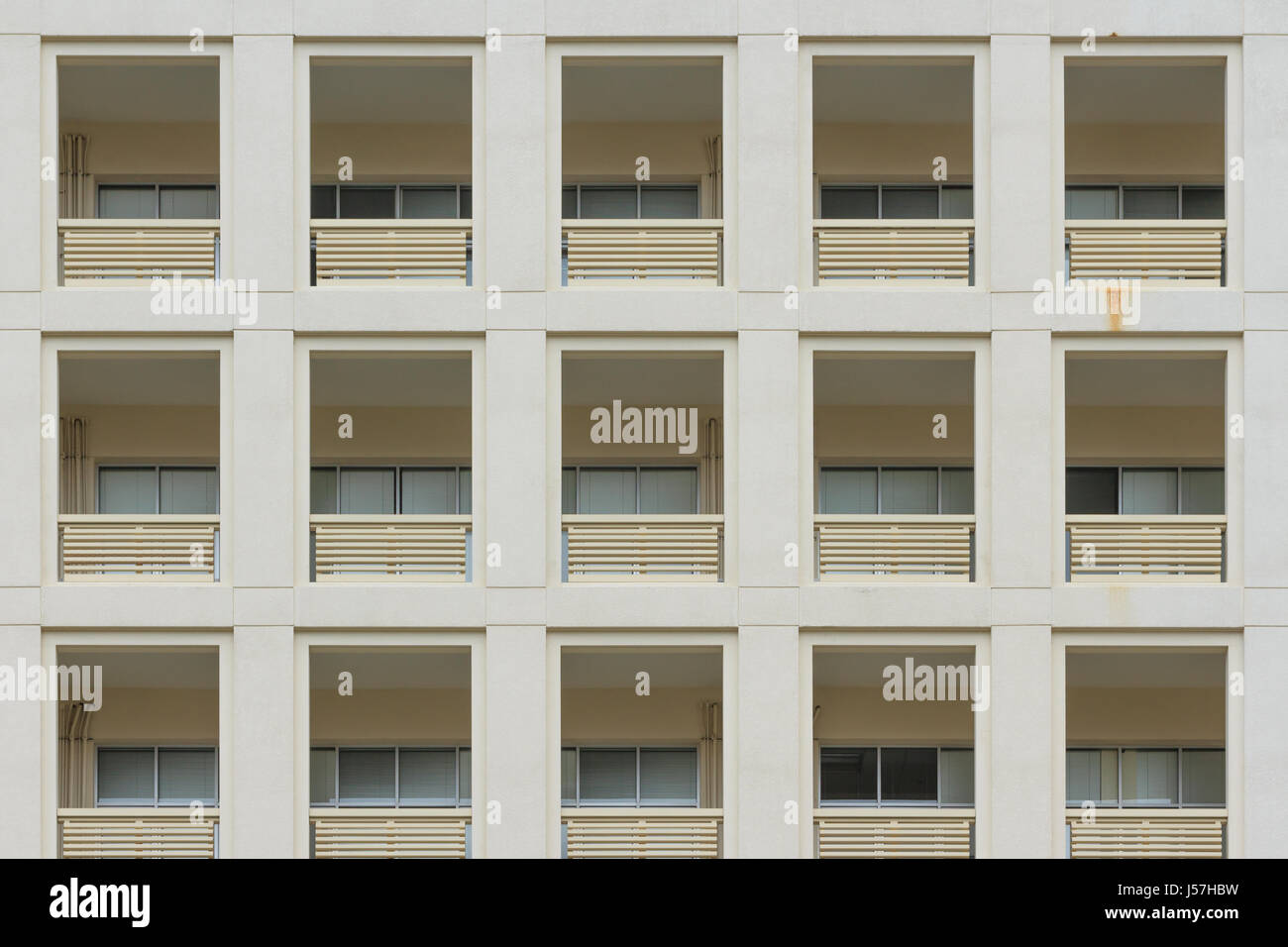 Many same windows on white building Stock Photo - Alamy