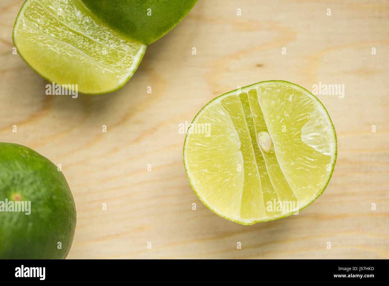 Green lemon with detail of inside Stock Photo - Alamy