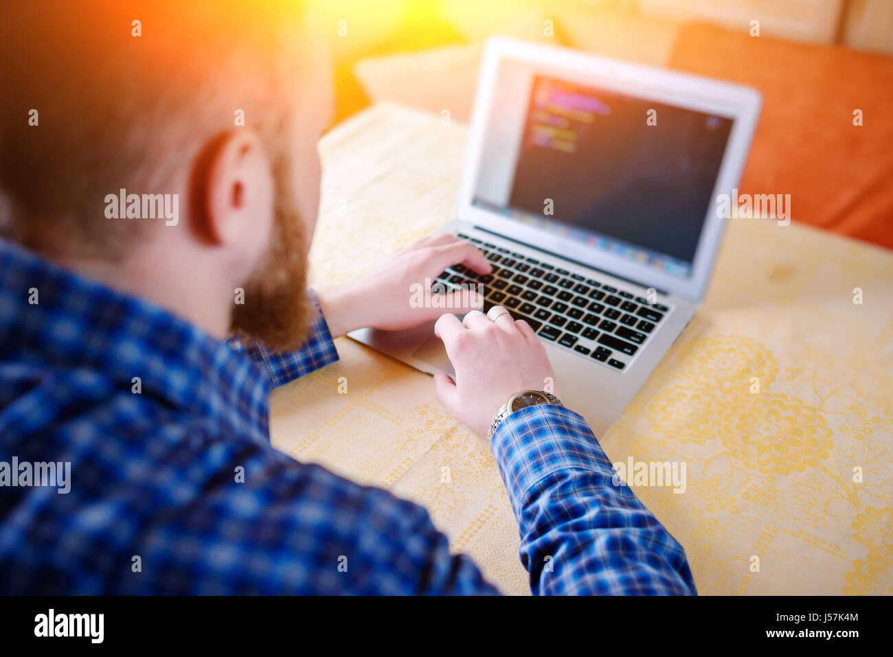 businessman using laptop at workplace - rear view Stock Photo - Alamy
