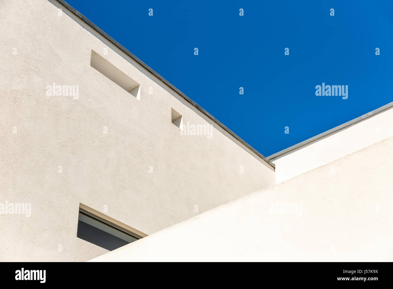 Striking Architectural Corner detail of modern white rendered building ...