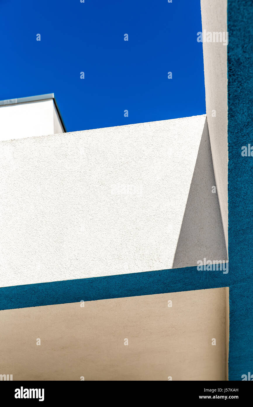 Architectural Corner detail of modern white and blue rendered building ...