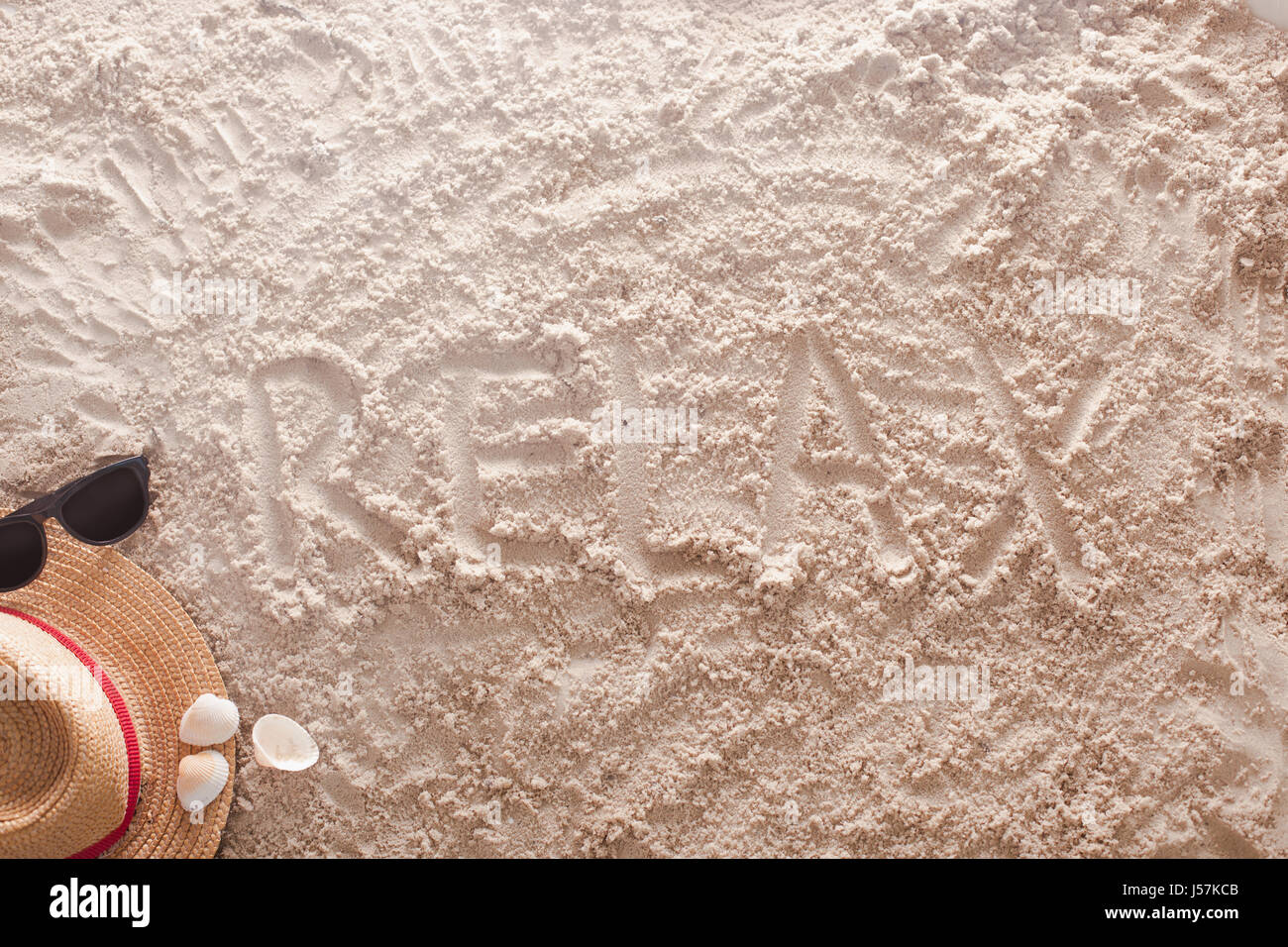 Relax written in sandy hi-res stock photography and images - Alamy
