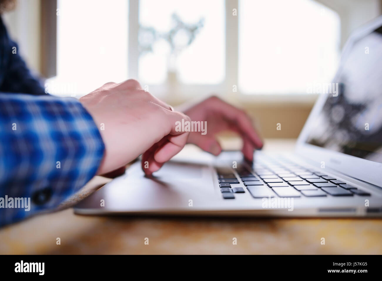 Close-up of a worker using a laptop computer Stock Photo - Alamy