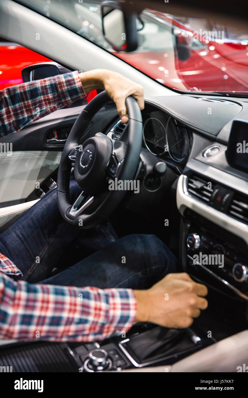 Handsome young man driving a modern car Stock Photo - Alamy