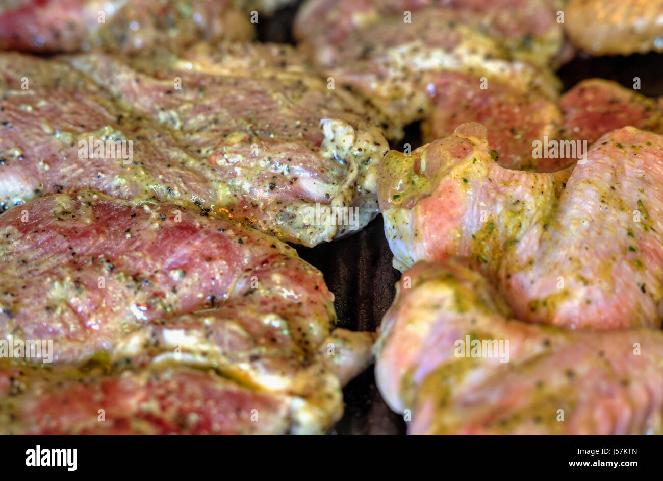 Baking fresh meat on grill closeup Stock Photo - Alamy