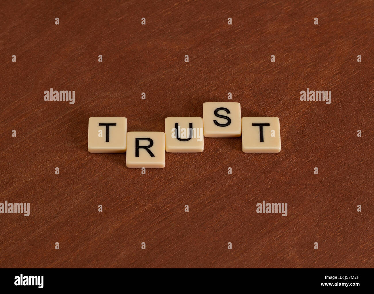 Trust sign. Loyalty concept. Ivory tiles with capital letters on ...