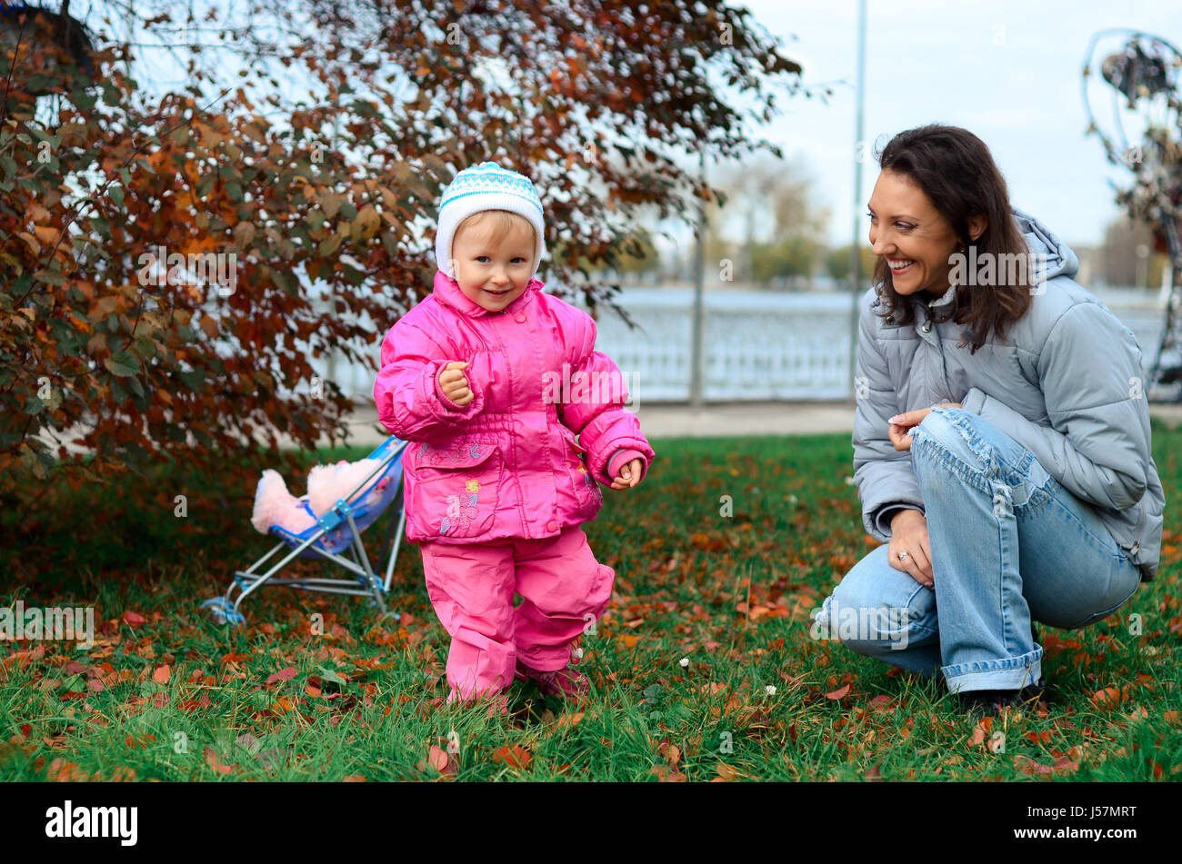 mother and daughter walking in the park Stock Photo - Alamy