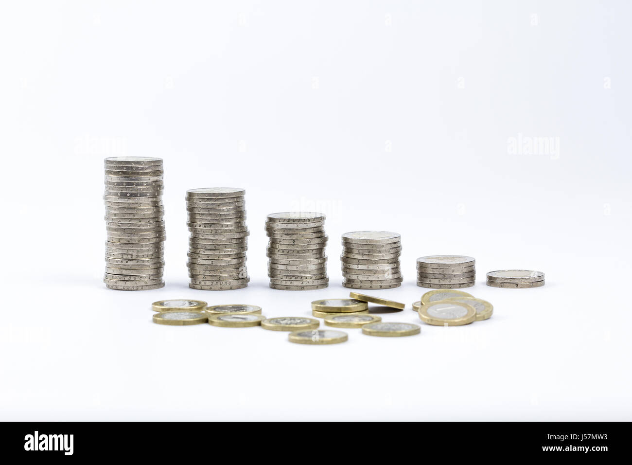 2 euro coins stacked and scattered some of 1 euro isolated on a white ...