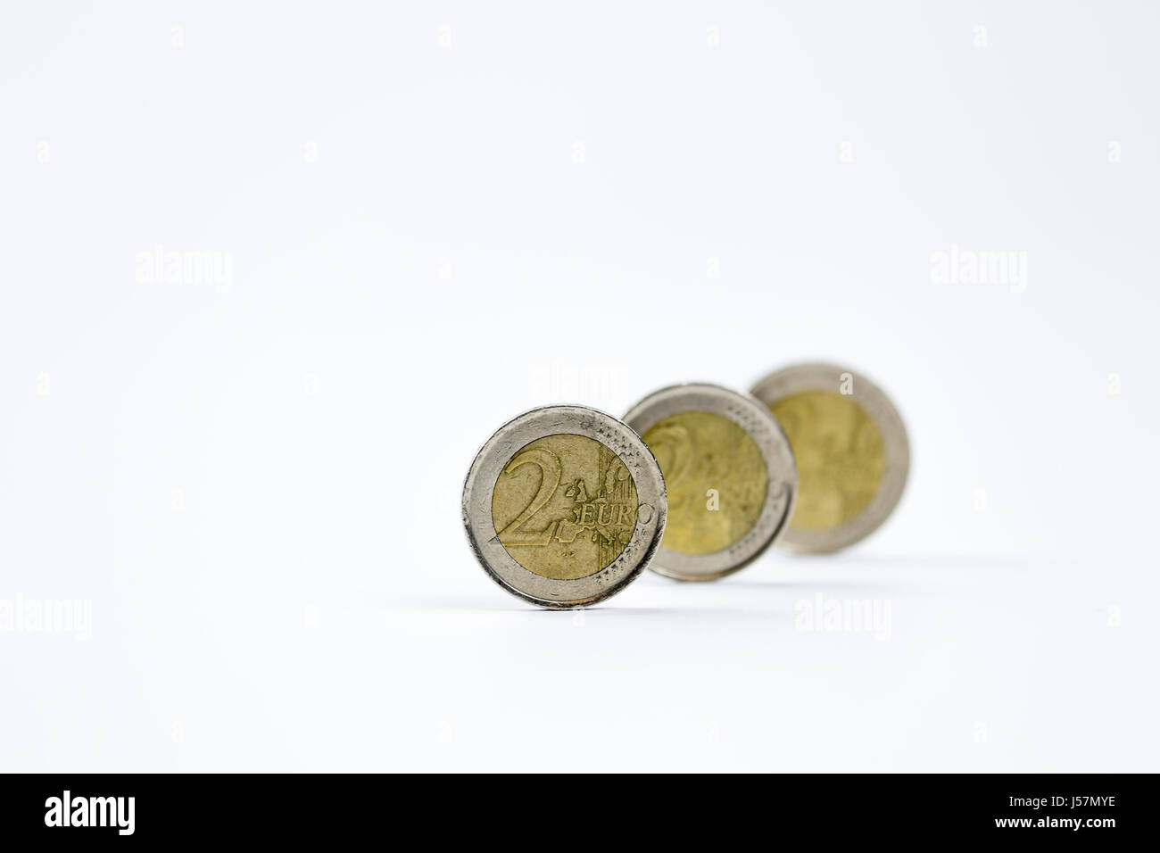 Two euro coins in a row isolated on a white background Stock Photo - Alamy