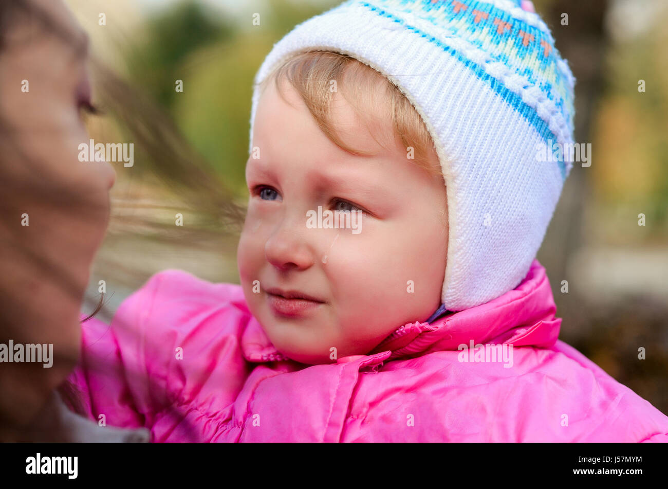 Little baby crying in the park, fall season Stock Photo - Alamy