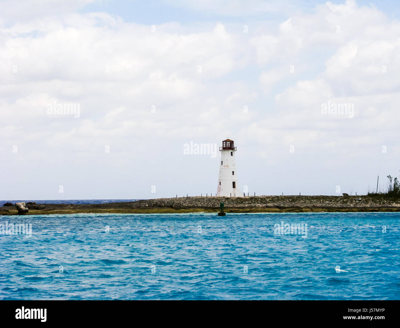 Lighthouse on the beach in a beautiful day Stock Photo - Alamy