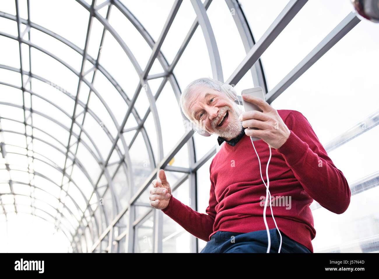 Strong man using a resistance band in his exercise routine Stock Photo ...