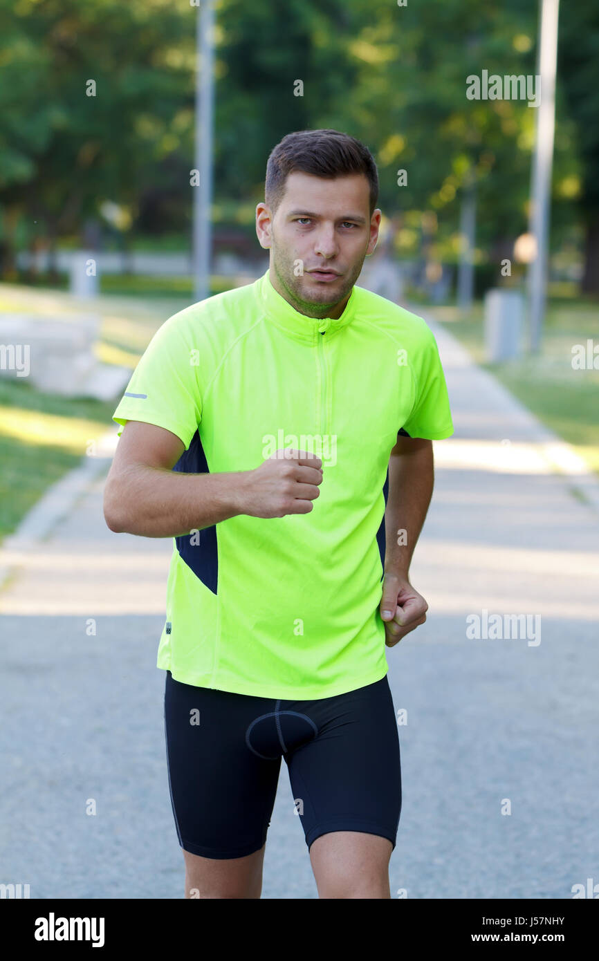 Healthy sport man running in the park Stock Photo - Alamy