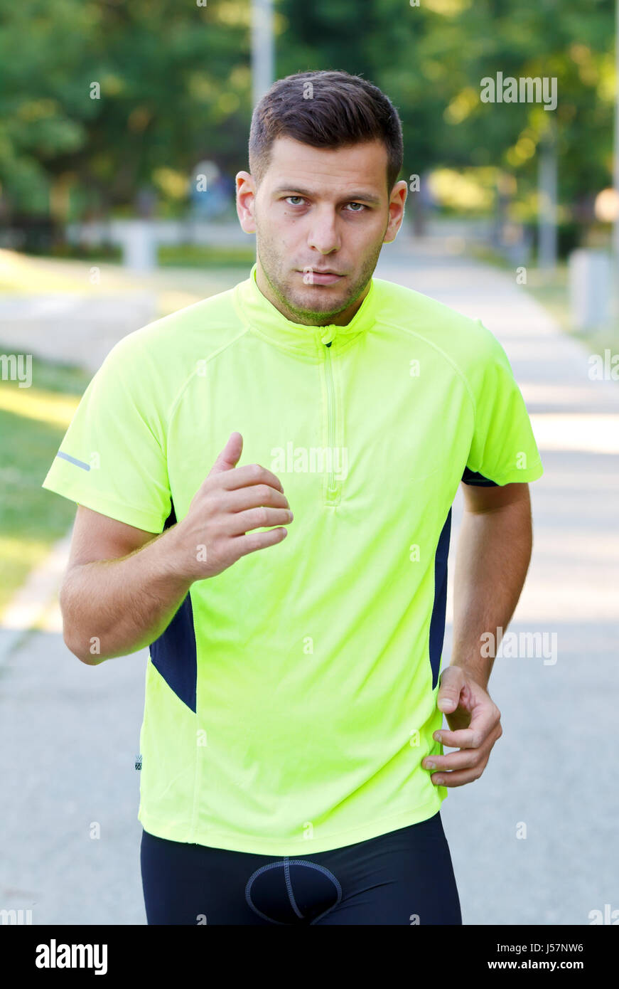 Healthy sport man running in the park Stock Photo - Alamy