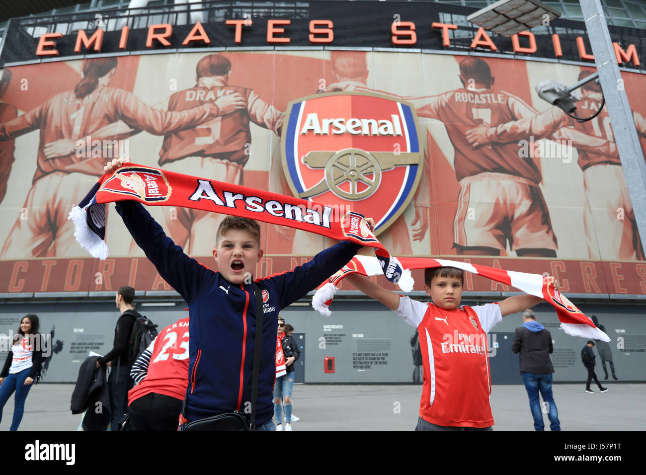 Arsenal fans pose for a picture before the Premier League match at the ...
