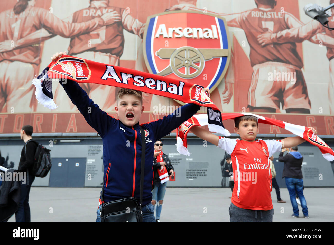 Arsenal fans pose for a picture before the Premier League match at the ...