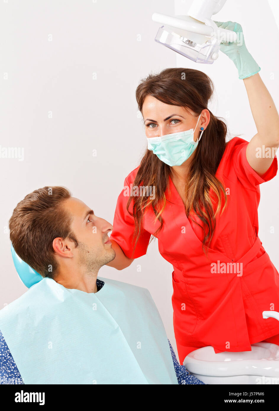 Female dentist is checking the patient's mouth Stock Photo - Alamy