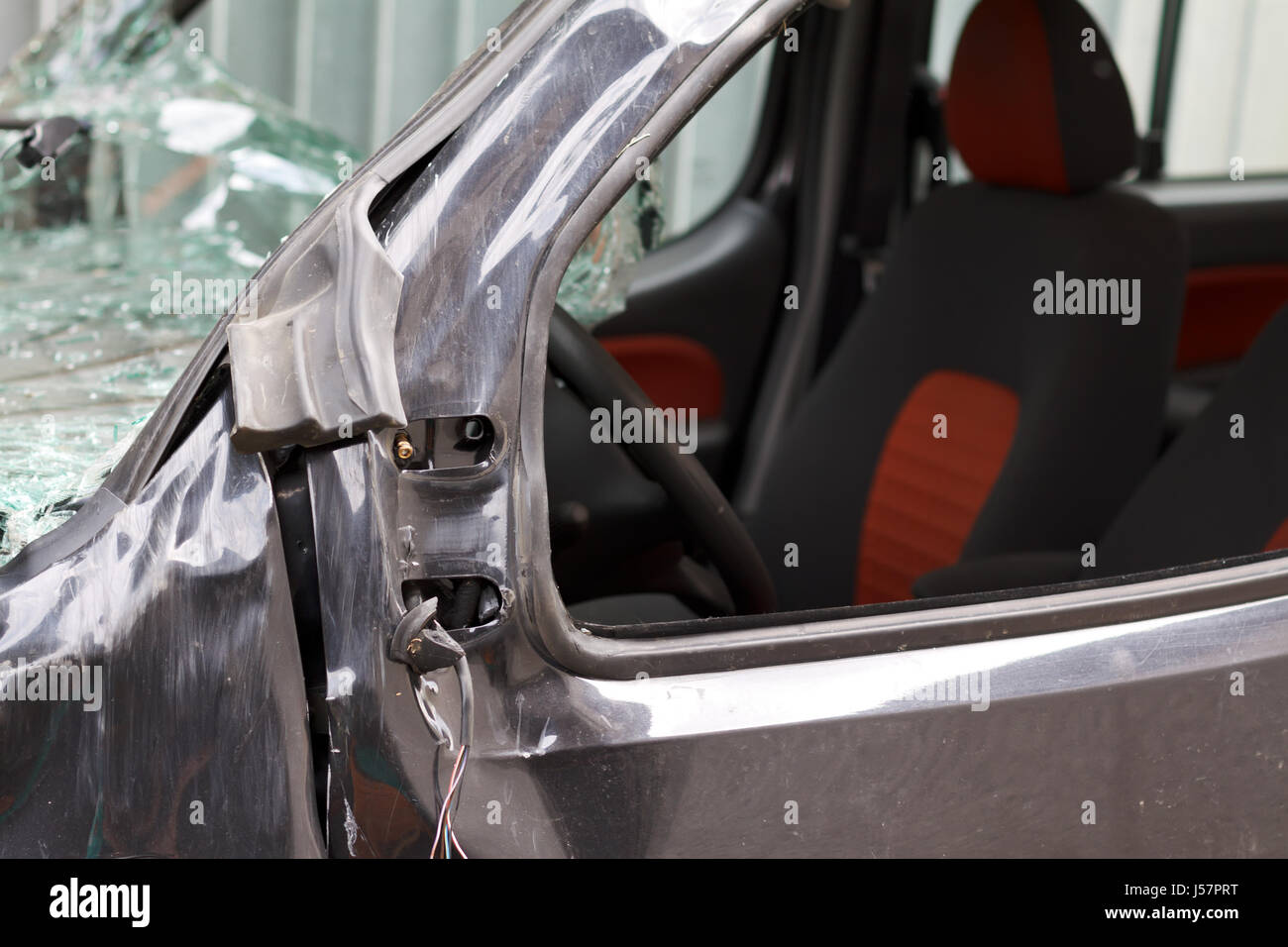 Black smashed family car after a serious accident Stock Photo - Alamy