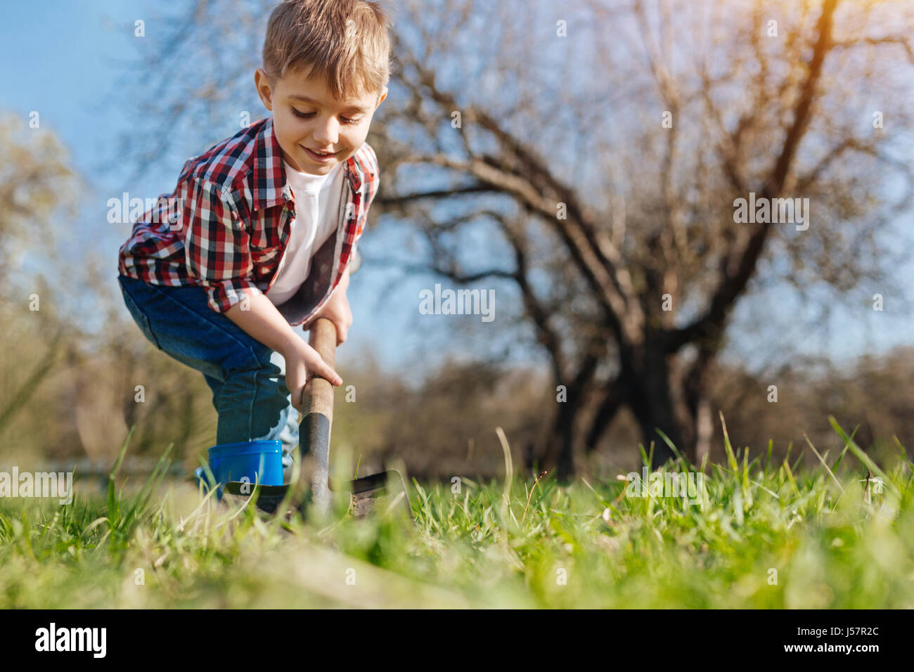 Industrious child gardening in spring Stock Photo - Alamy