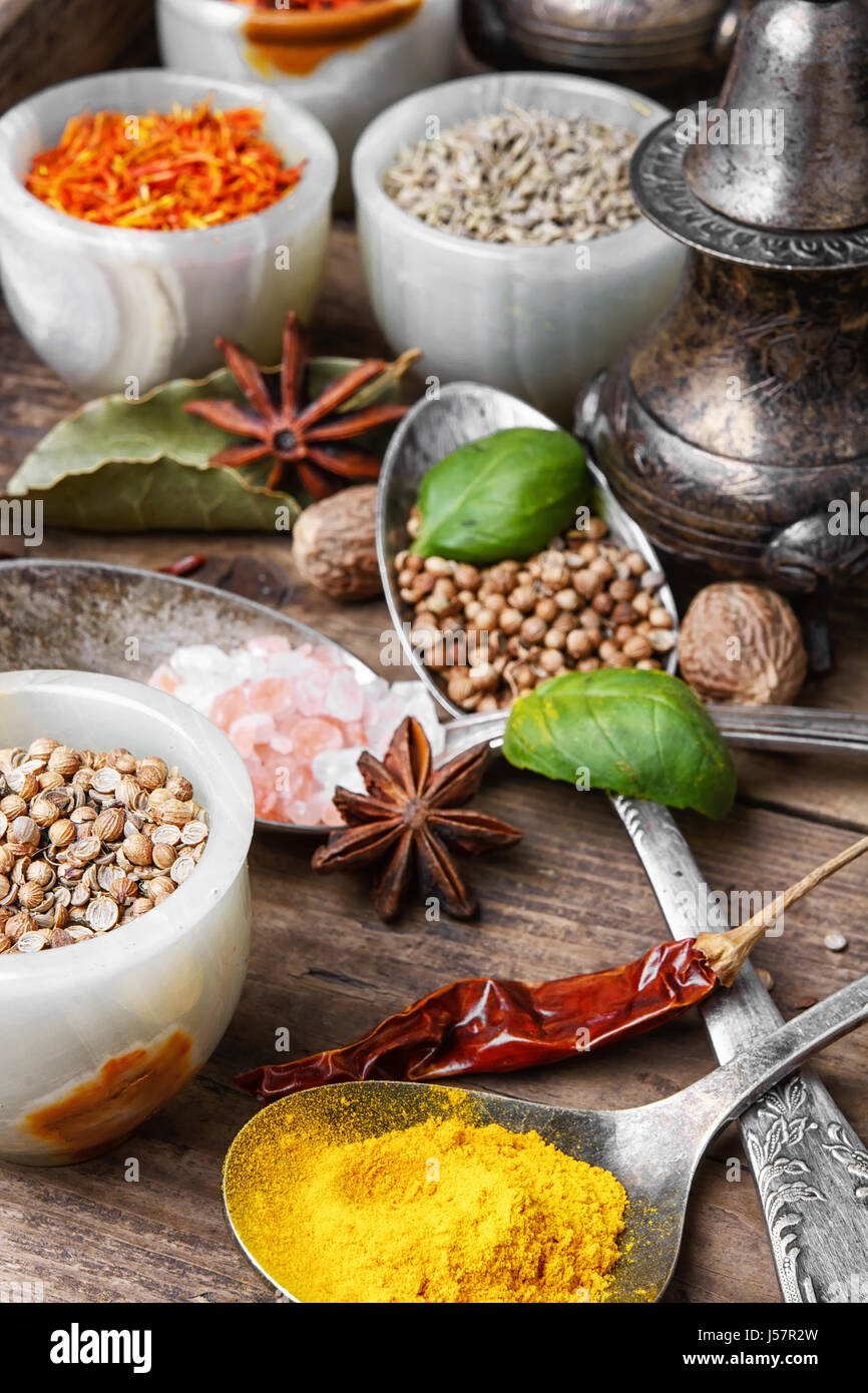 Variety of spices and seasonings on kitchen table Stock Photo - Alamy