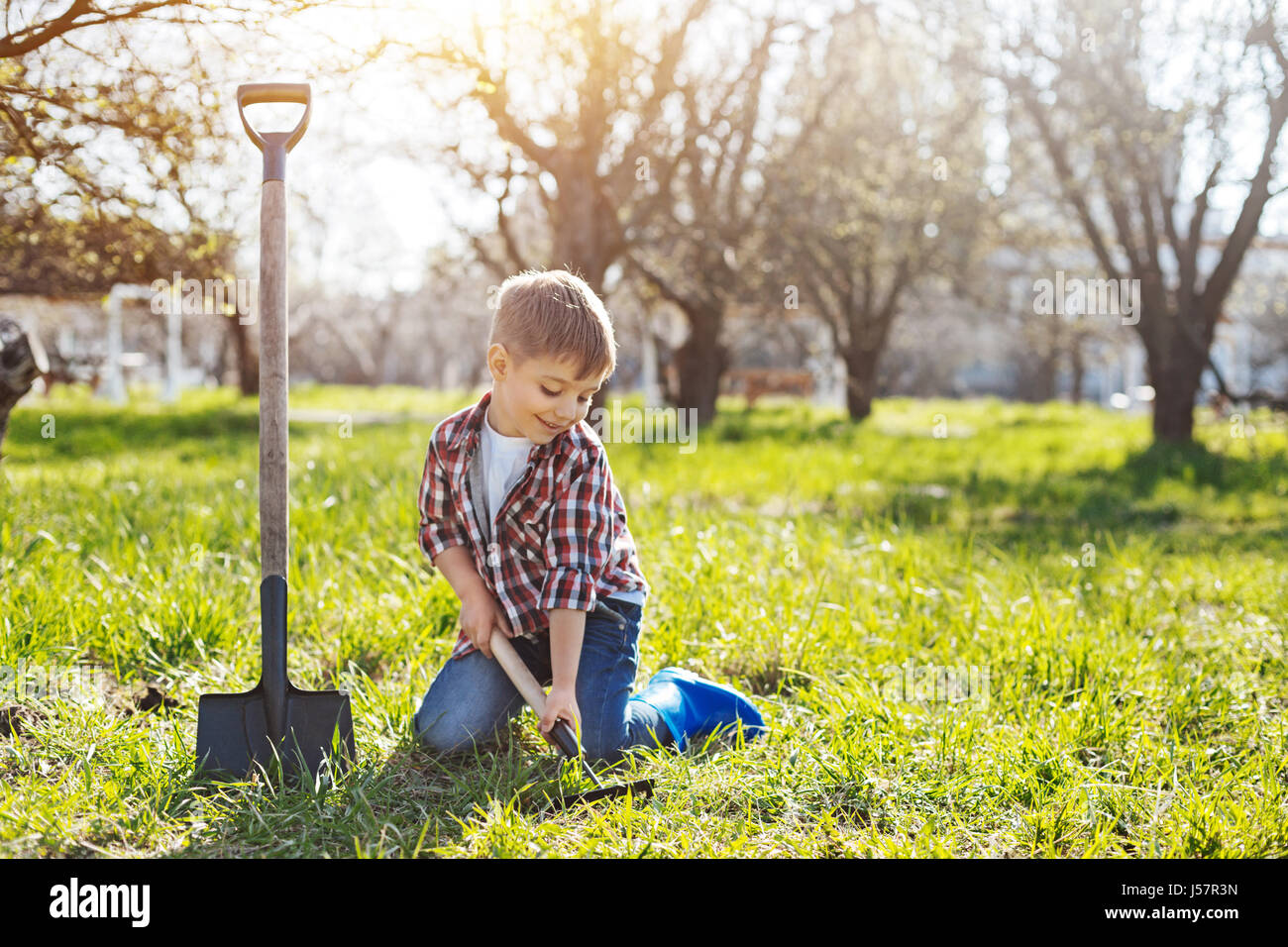 Child scooping soil High Resolution Stock Photography and Images - Alamy