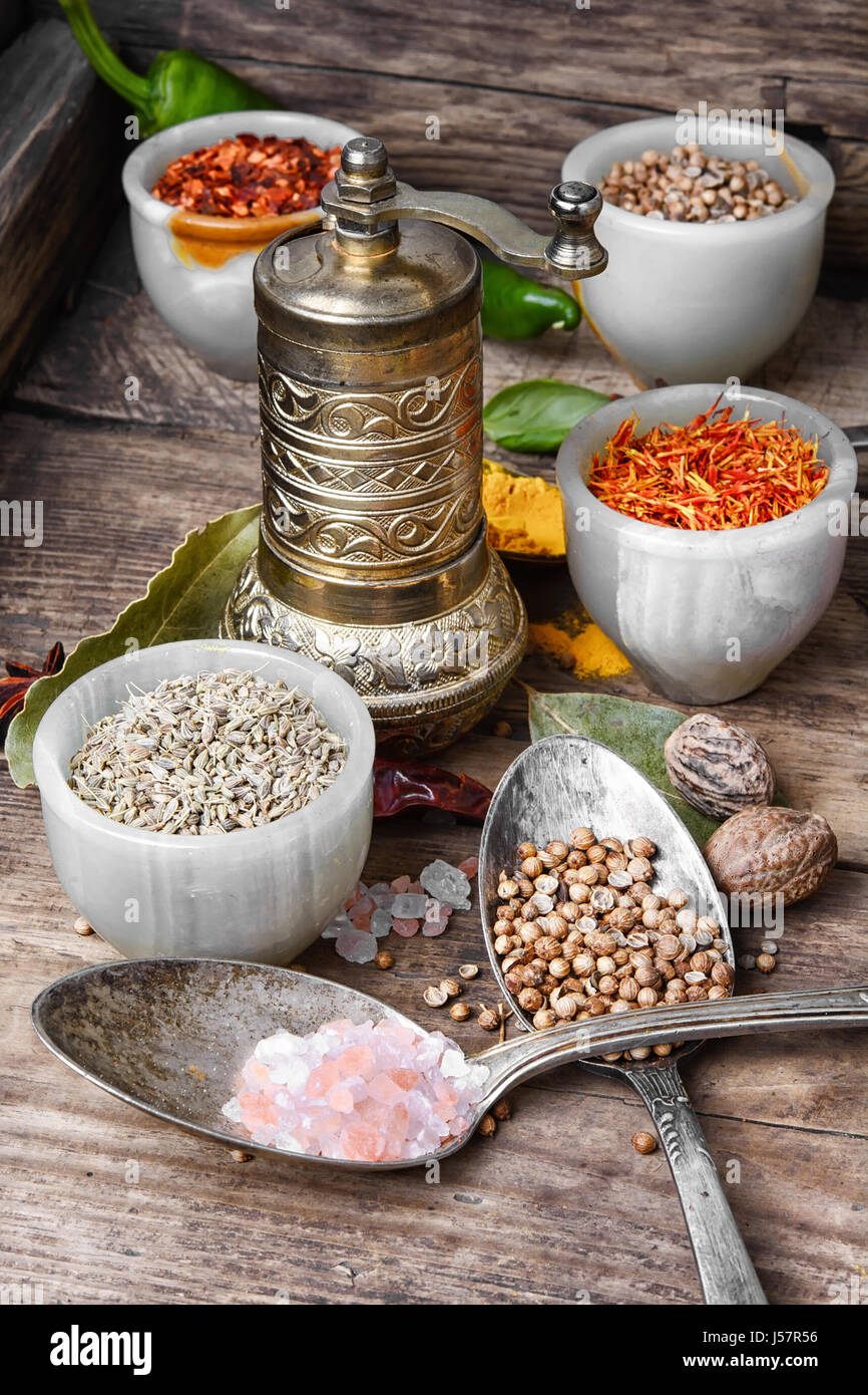 Variety of spices and seasonings on kitchen table Stock Photo - Alamy