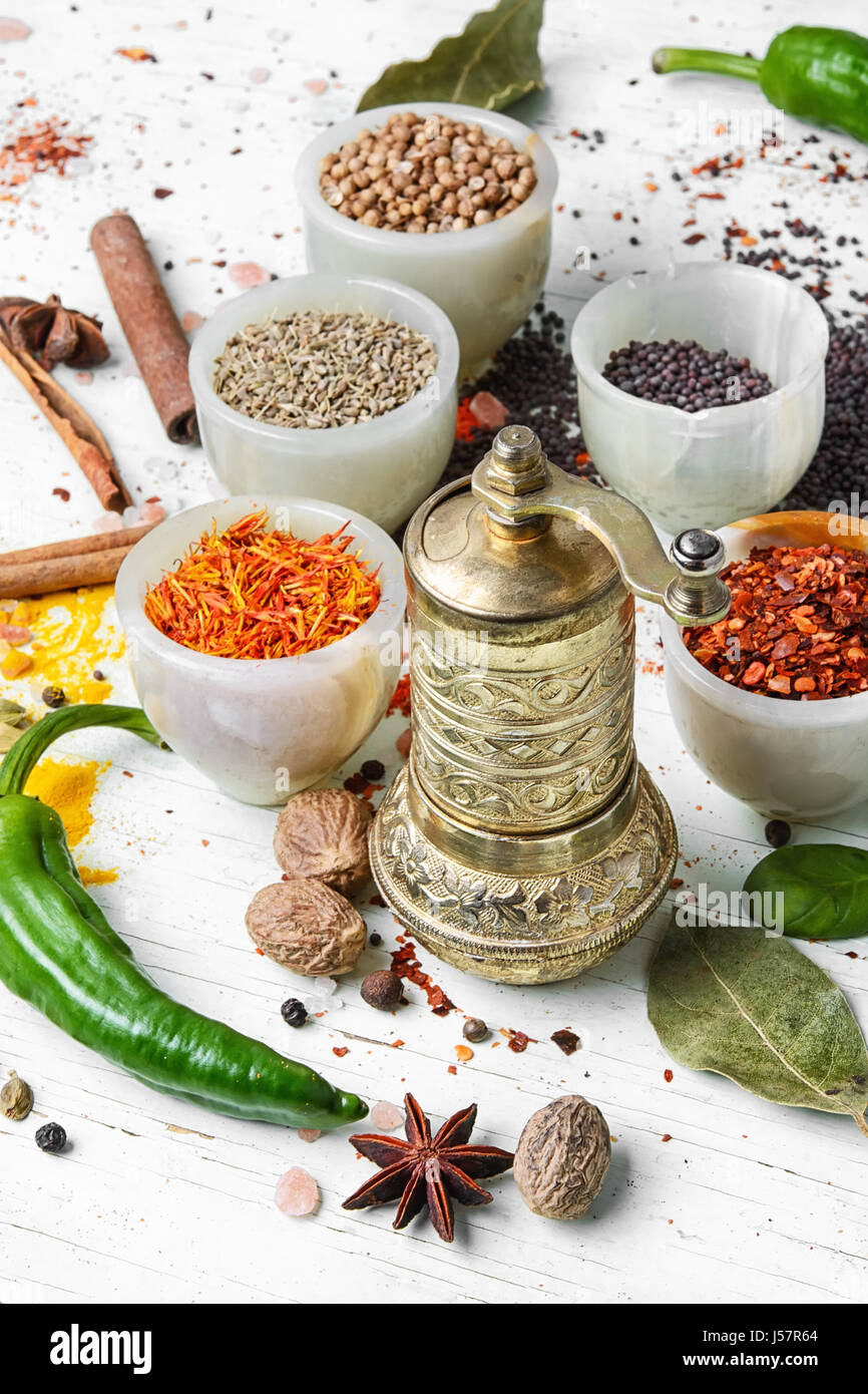 Variety of spices and seasonings on kitchen table Stock Photo - Alamy