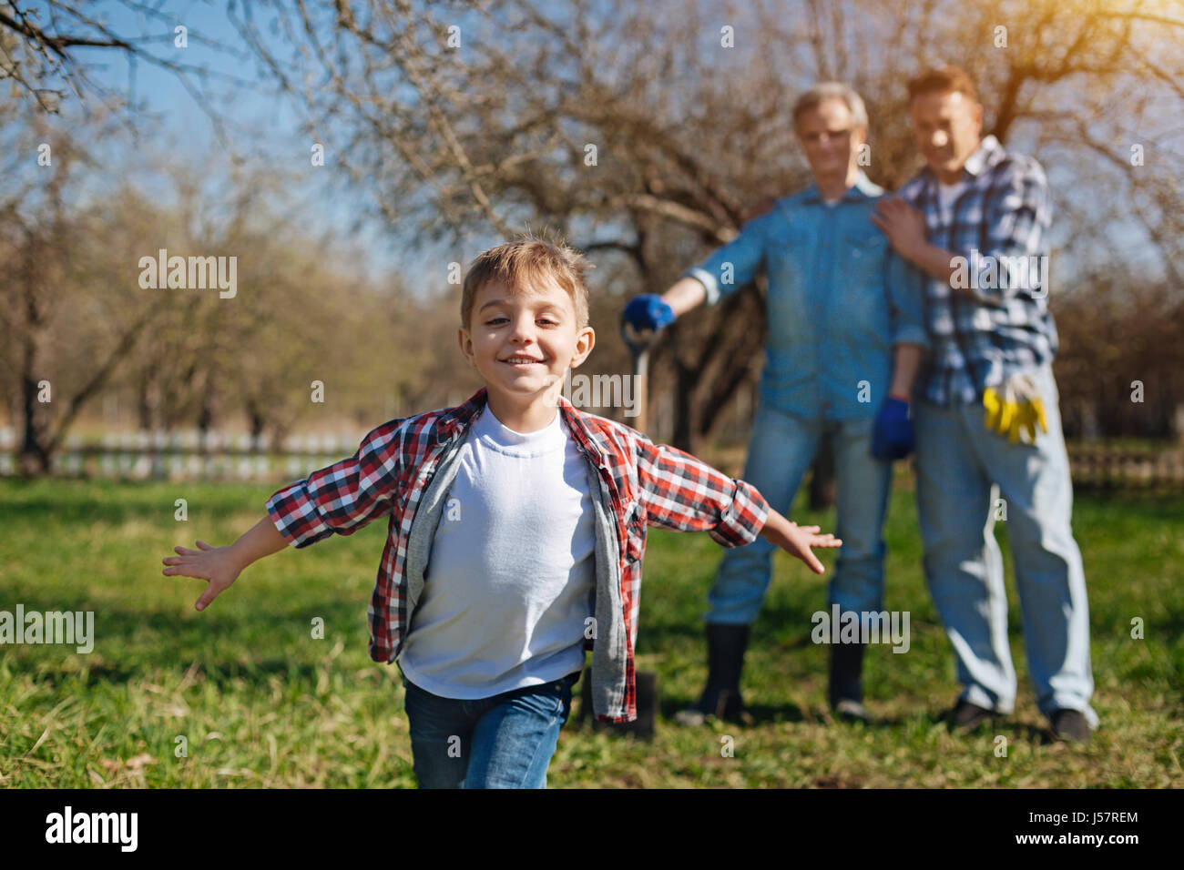 Adorable boy having fun in garden Stock Photo - Alamy