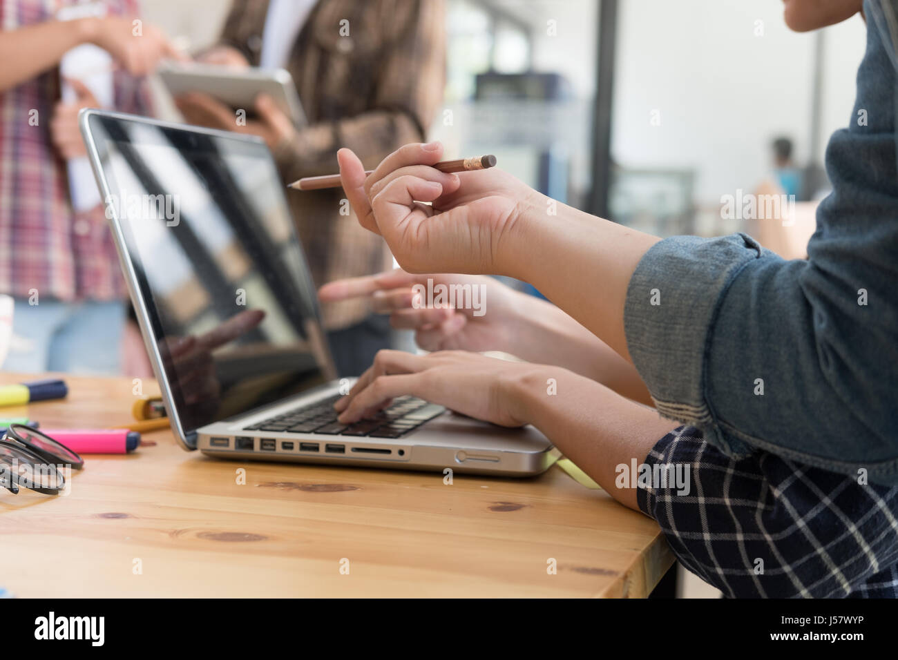 young university students studying with computer in cafe. Group of ...