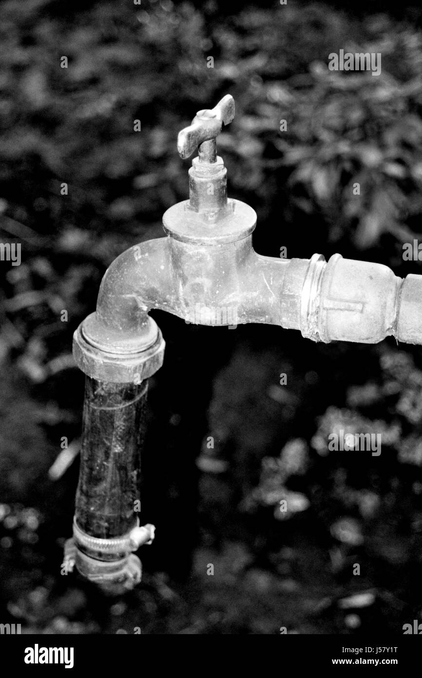 Old garden water tap Black and White Stock Photos & Images - Alamy