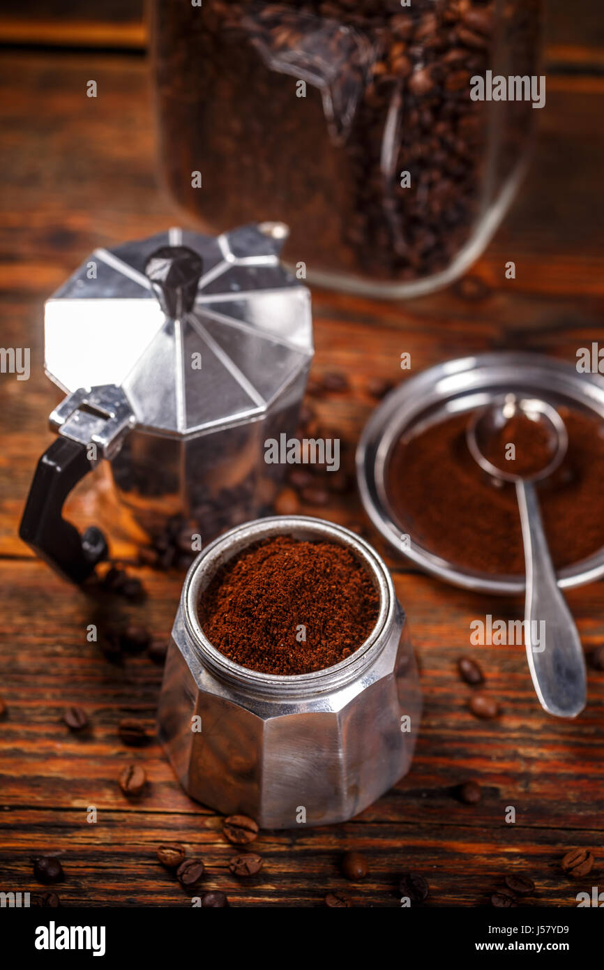 Old coffee maker in vintage style on wooden background Stock Photo - Alamy