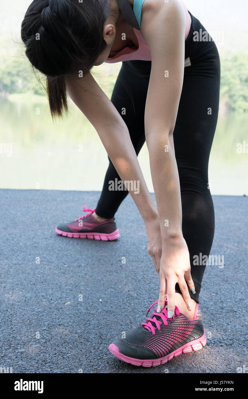 Female sport fitness athlete runner getting ready for jogging outdoors ...
