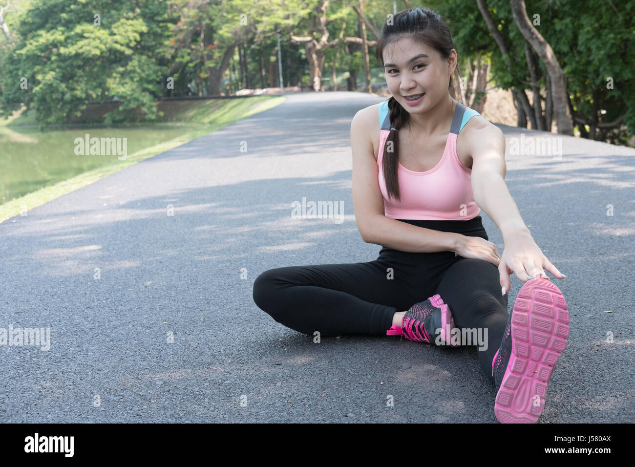 Female sport fitness athlete runner getting ready for jogging outdoors ...