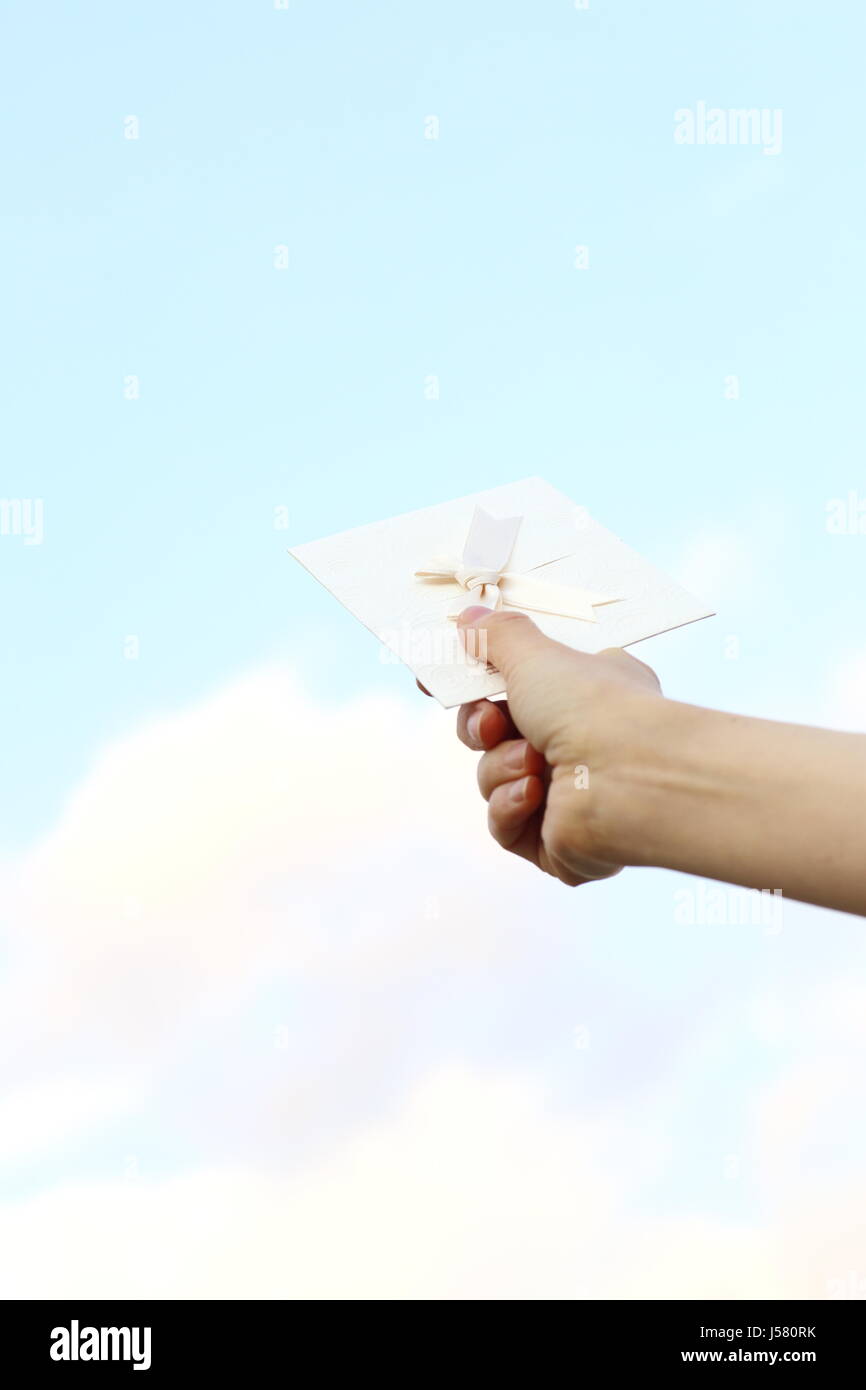 Woman Hand Holding Invitation Card Stock Photo - Alamy