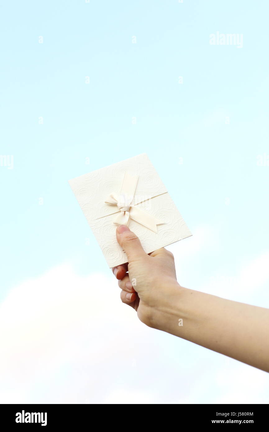 Woman Hand Holding Invitation Card Stock Photo - Alamy