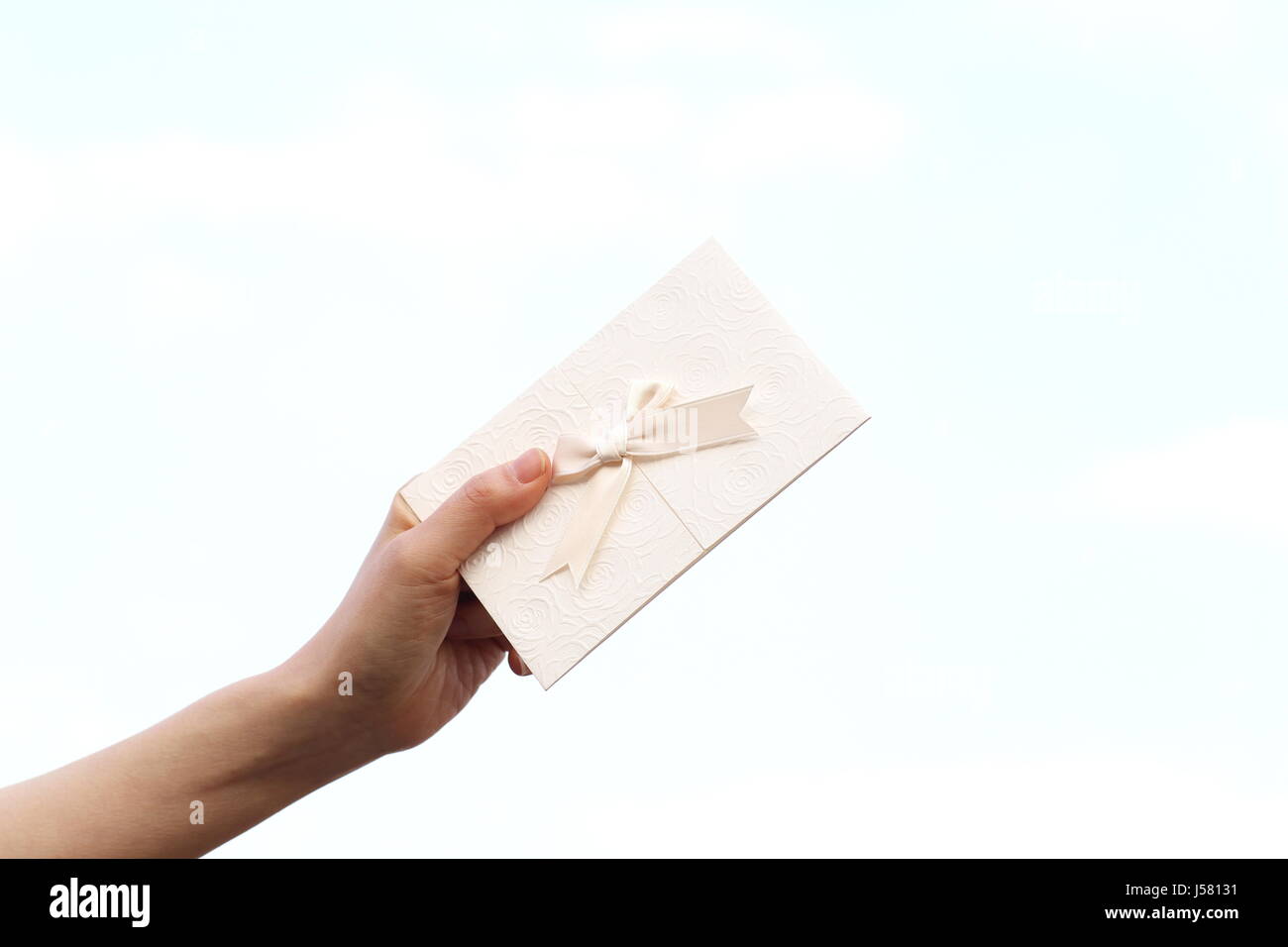 Woman Hand Holding Invitation Card Stock Photo - Alamy