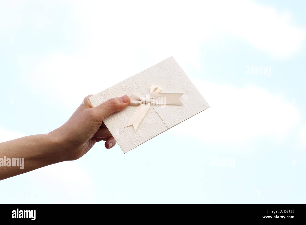 Woman Hand Holding Invitation Card Stock Photo - Alamy