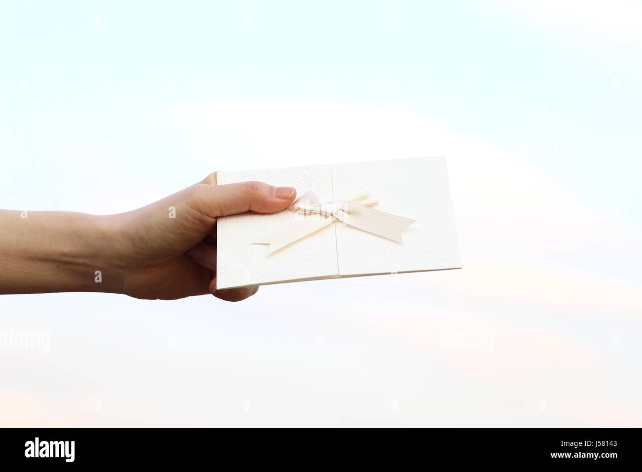 Woman Hand Holding Invitation Card Stock Photo - Alamy