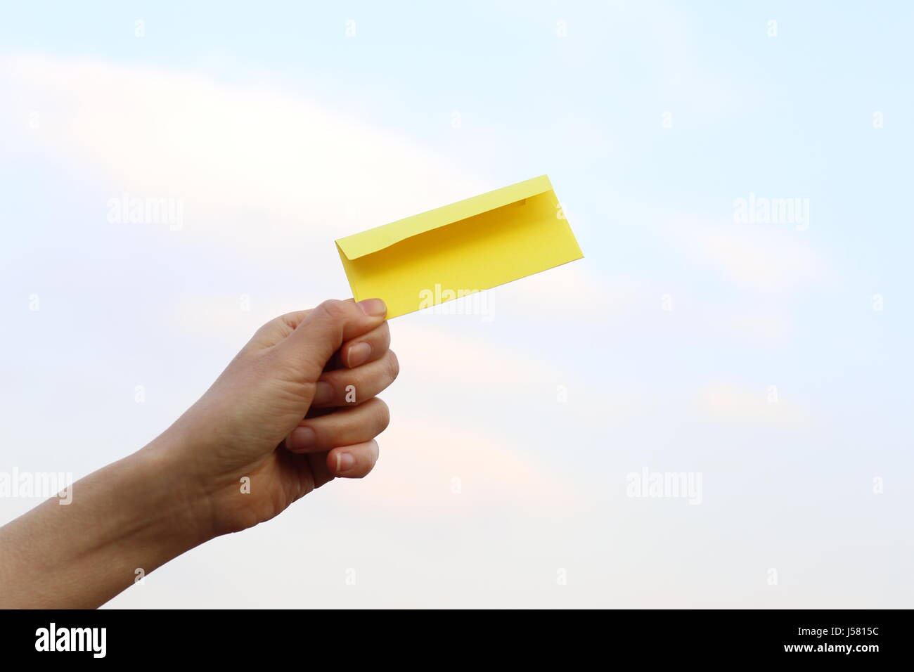 Holding an envelope hi-res stock photography and images - Alamy