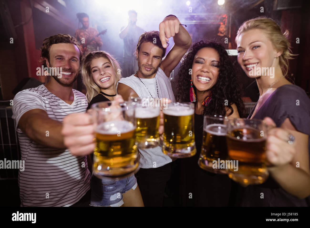 Portrait of young woman holding beer mug hi-res stock photography and ...