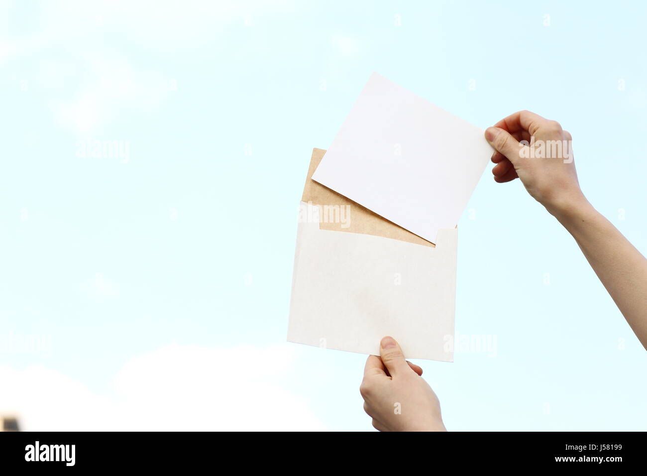Woman Hand Holding Envelope Stock Photo - Alamy