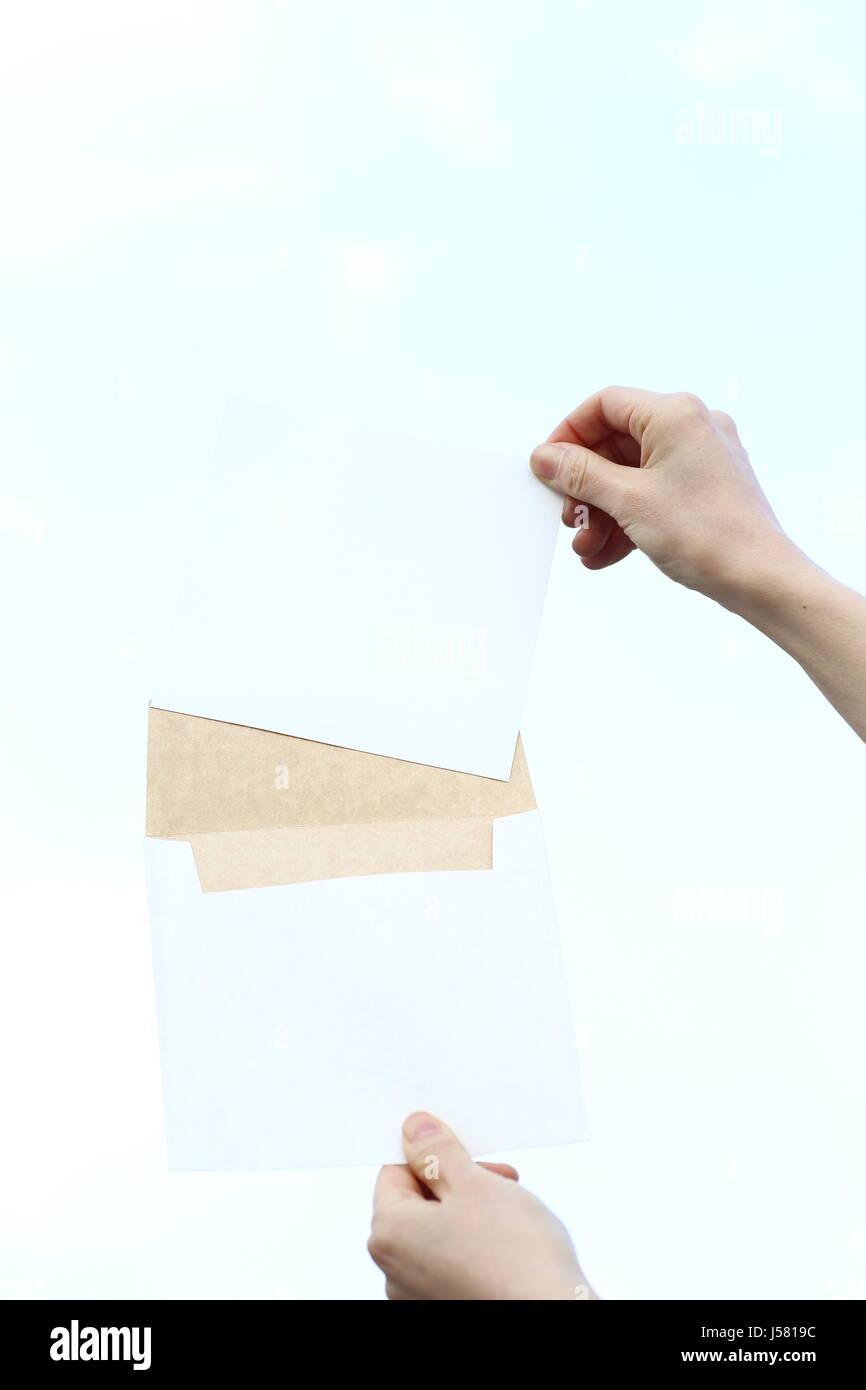 Woman Hand Holding Envelope Stock Photo - Alamy