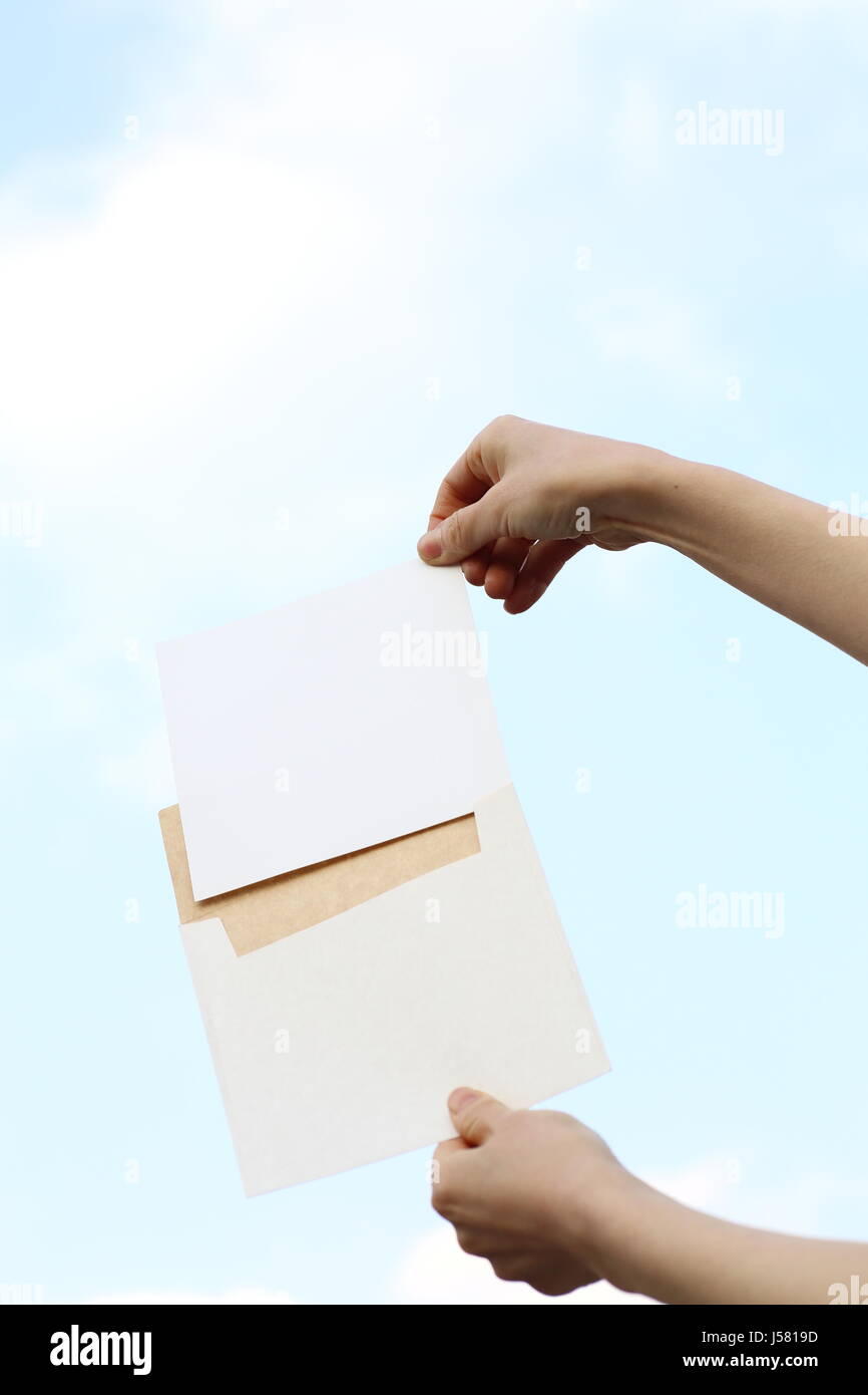 Woman Hand Holding Envelope Stock Photo - Alamy