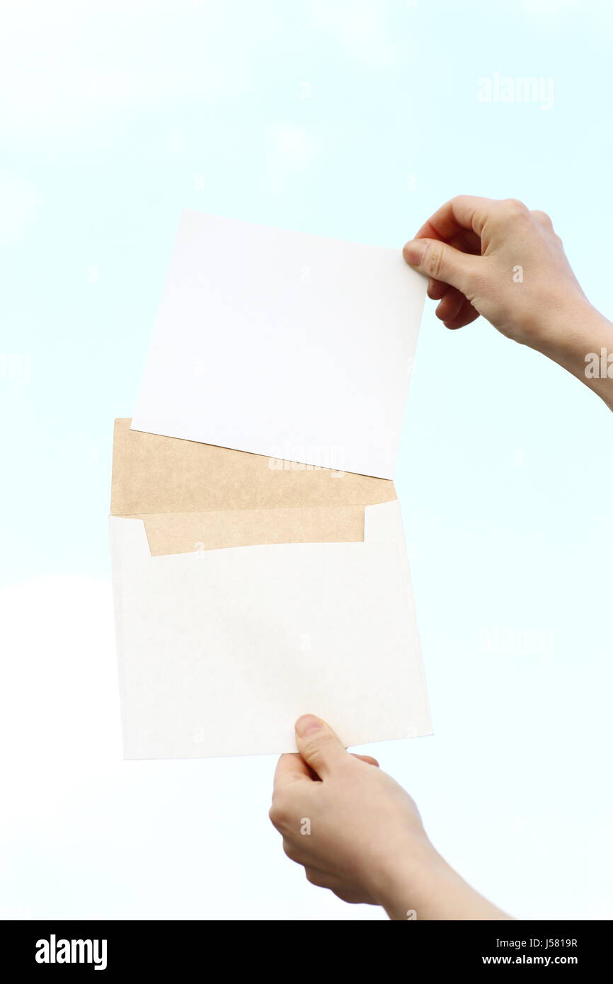 Woman Hand Holding Envelope Stock Photo - Alamy