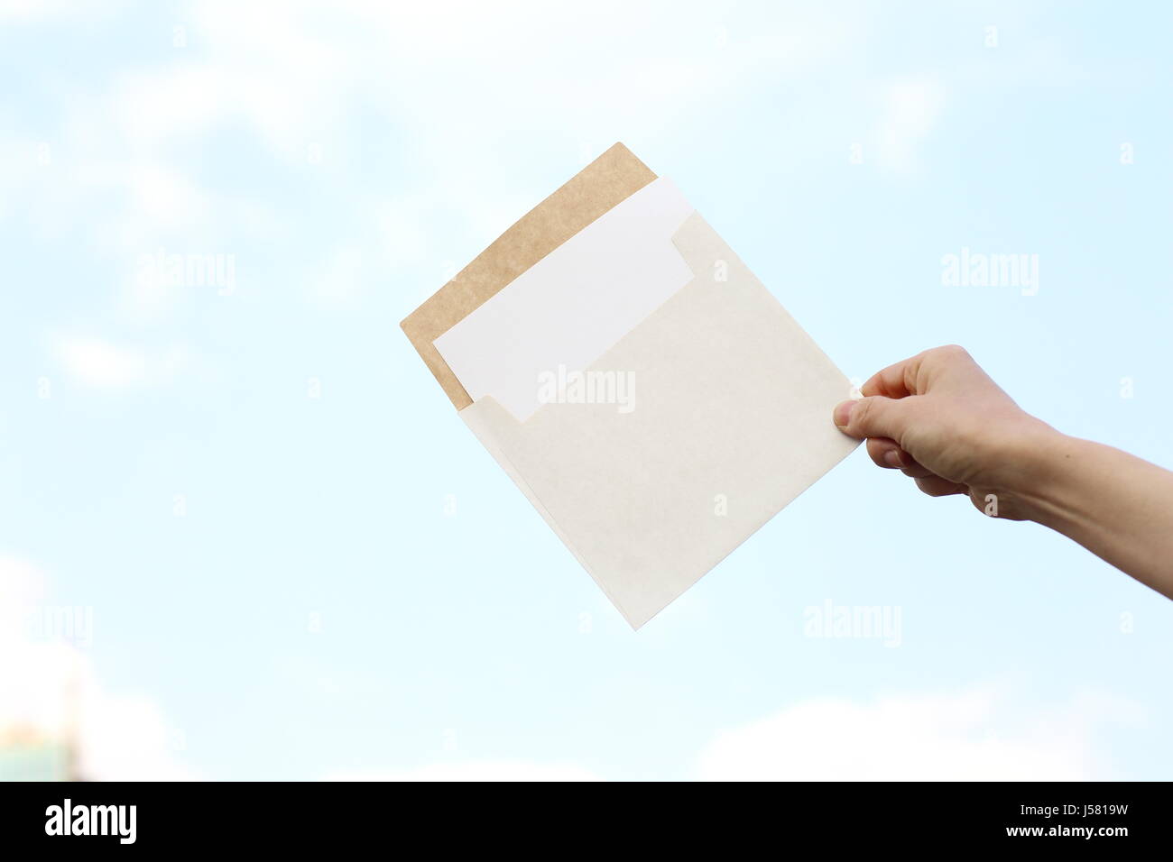 Woman Hand Holding Envelope Stock Photo - Alamy