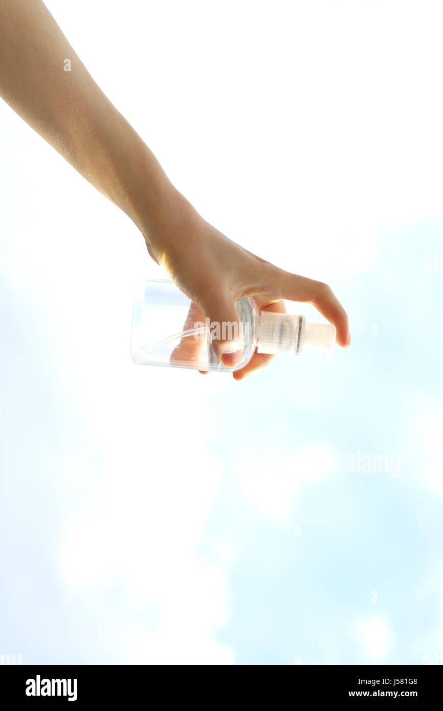 Woman Hand Holding Spray Stock Photo - Alamy