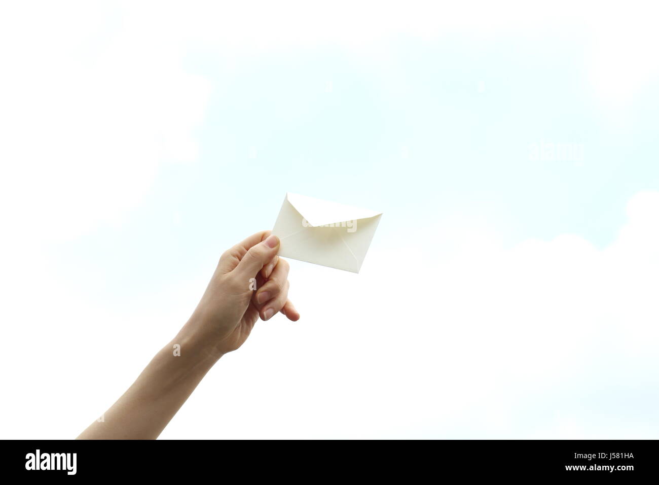 Woman Hand Holding Envelope Stock Photo - Alamy