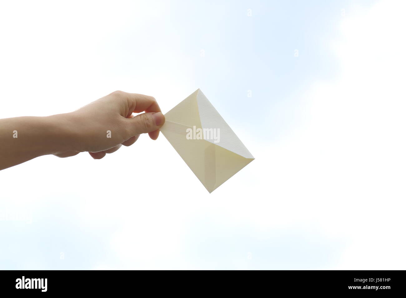 Woman Hand Holding Envelope Stock Photo - Alamy