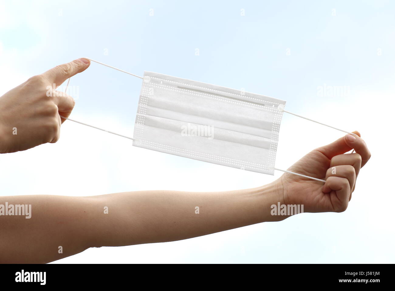 Woman Hand Holding Mask Stock Photo - Alamy