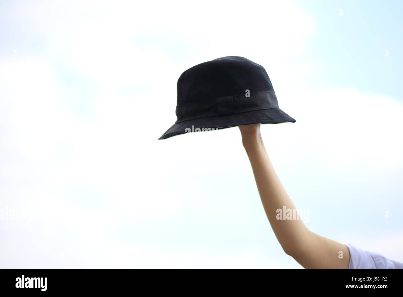 Woman Hand Holding Hat Stock Photo - Alamy